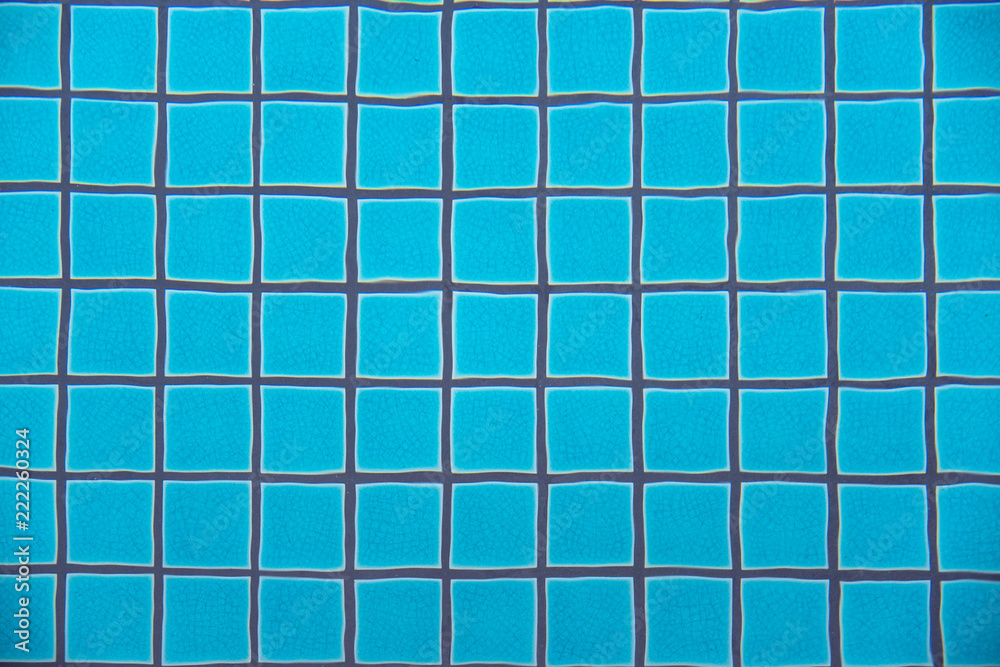 Swimming pool clear water showing turquoise blue clay square tiles and ...