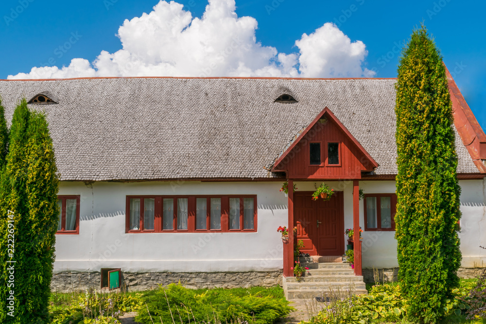 Beautiful old romanian traditional house with wood tiles roof, front ...