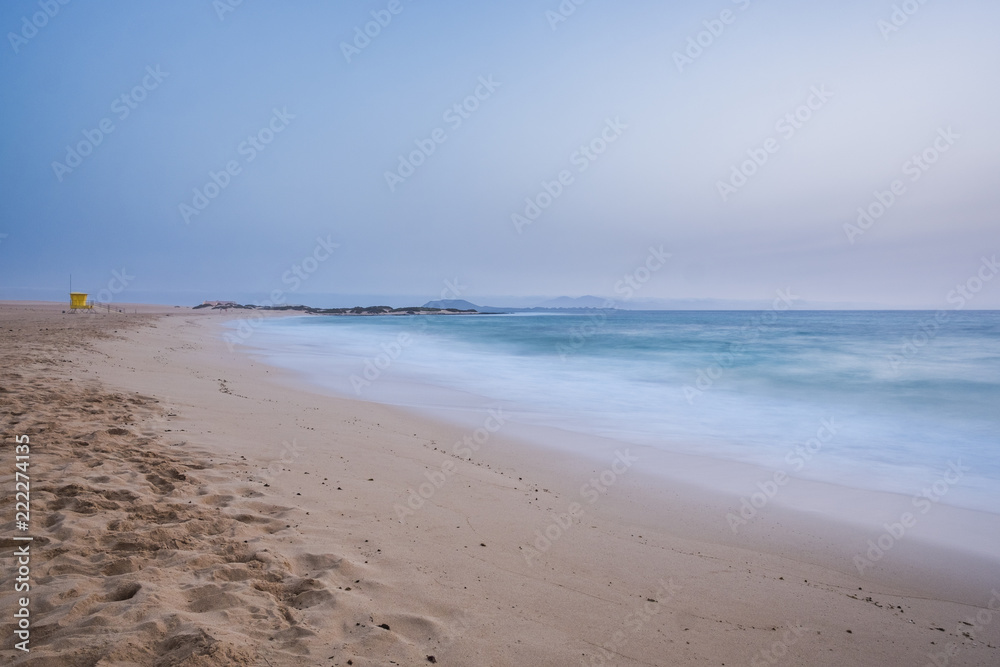lonely beach with no body there early morning with long exposure shoot ...