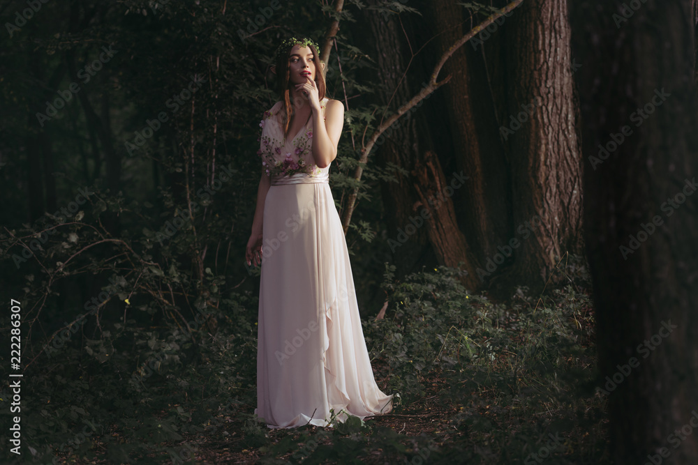 elegant mystic elf in white dress with flowers in woods Stock Photo ...