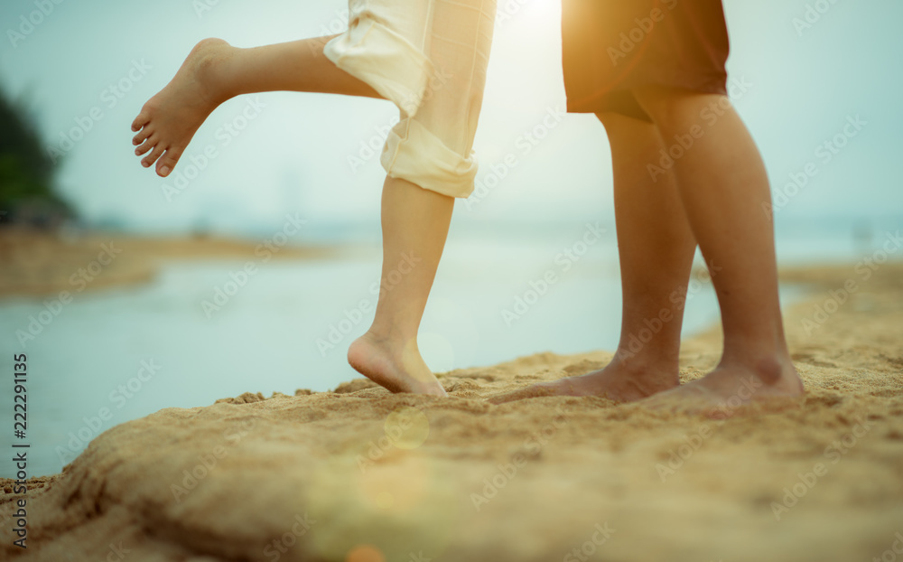 leg standing up on the air tiptoe of a loving couple on curve edge of ...