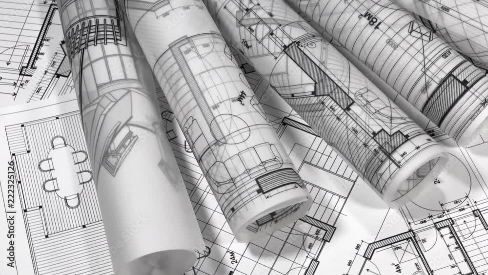 Blueprints - rolls of architectural drawings smoothly rotate on the ...