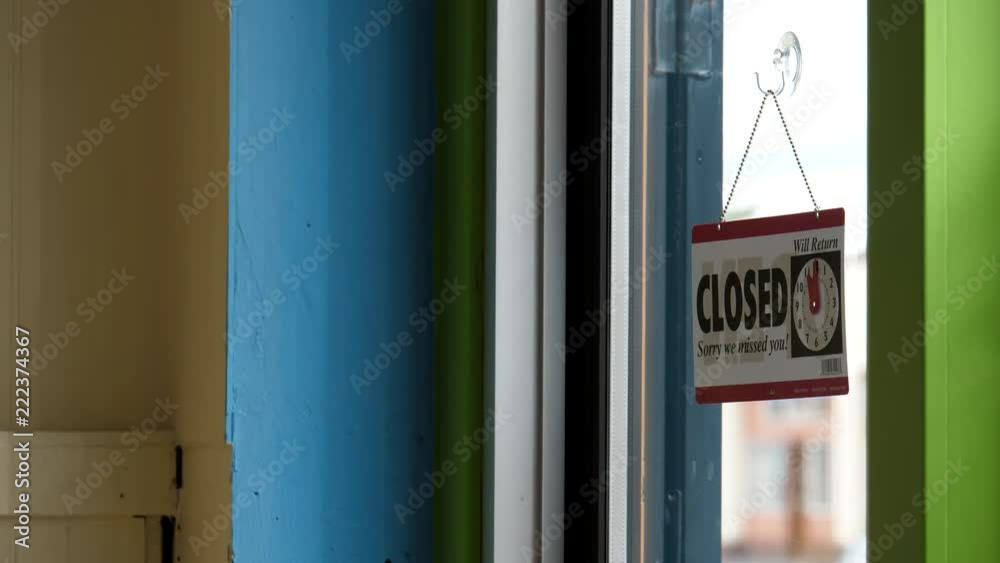 Cute Hispanic teen turns the closed sign to open at their family owned ...