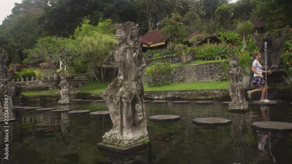 Hindu Balinese Water Palace Tirta Gangga with statues of the gods ...