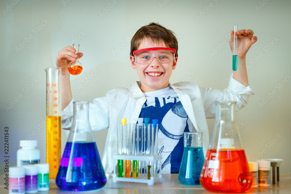 Cute boy is making science experiments in a laboratory Stock Photo ...