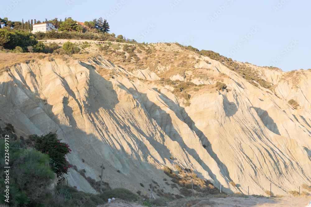 Interesting texture of the clay natural wall of a cliff in front of the ...
