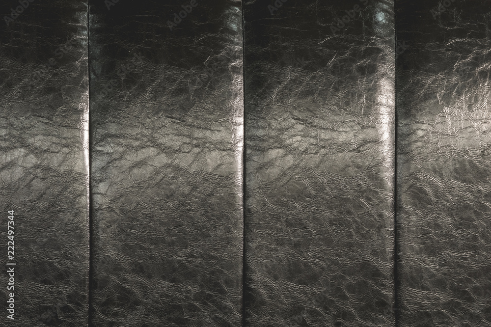 The texture of the real leather on the back of the bed. Vertical ...