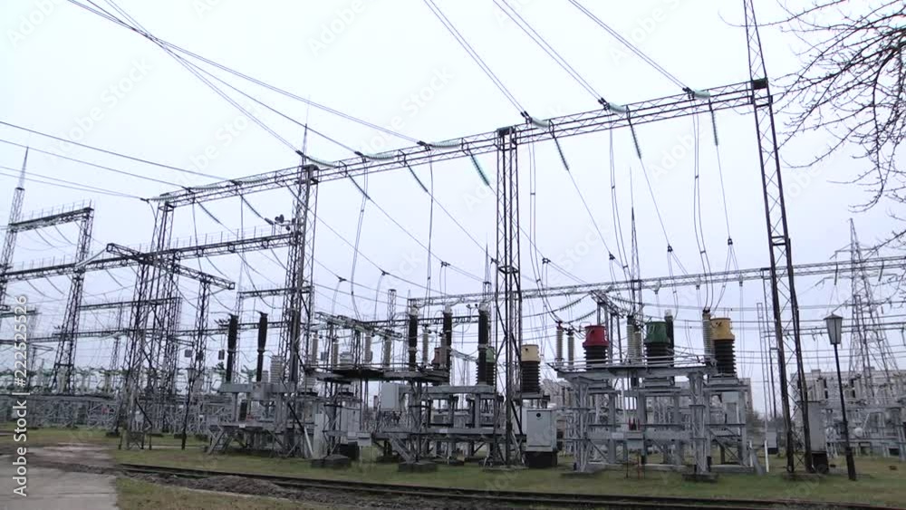 Air high-voltage switches. Electrical poles with wires and insulators ...