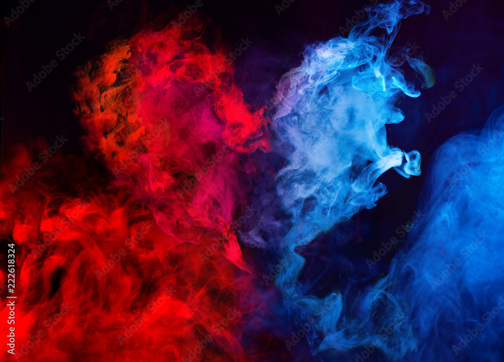 Abstract shapes of red and blue smoke in heart shape at dark background ...