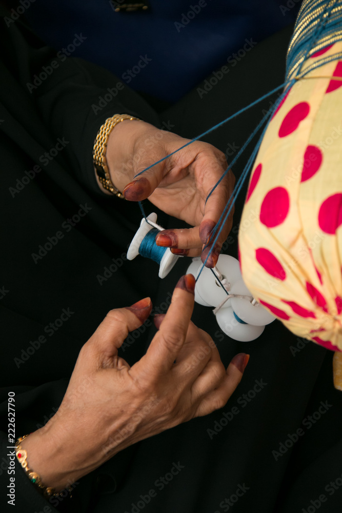 Hands of Emiraty woman who is making traditional embroidery talli Stock ...