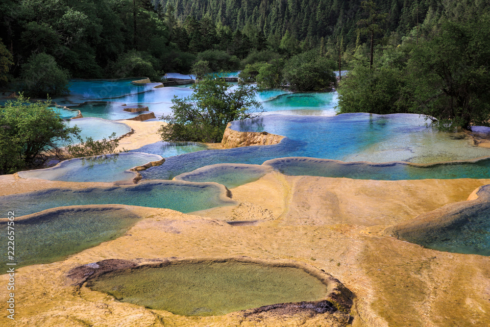 Pools of colorful blue water in Huanglong Scenic Area in Sichuan ...