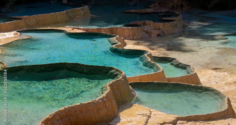 Pools of colorful blue water in Huanglong Scenic Area in Sichuan ...