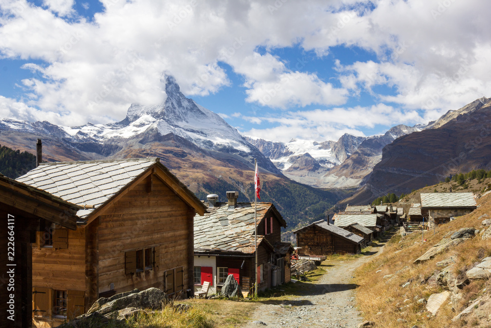 Village of Eggen with tradtional barns and sheds beneath the Matterhorn ...