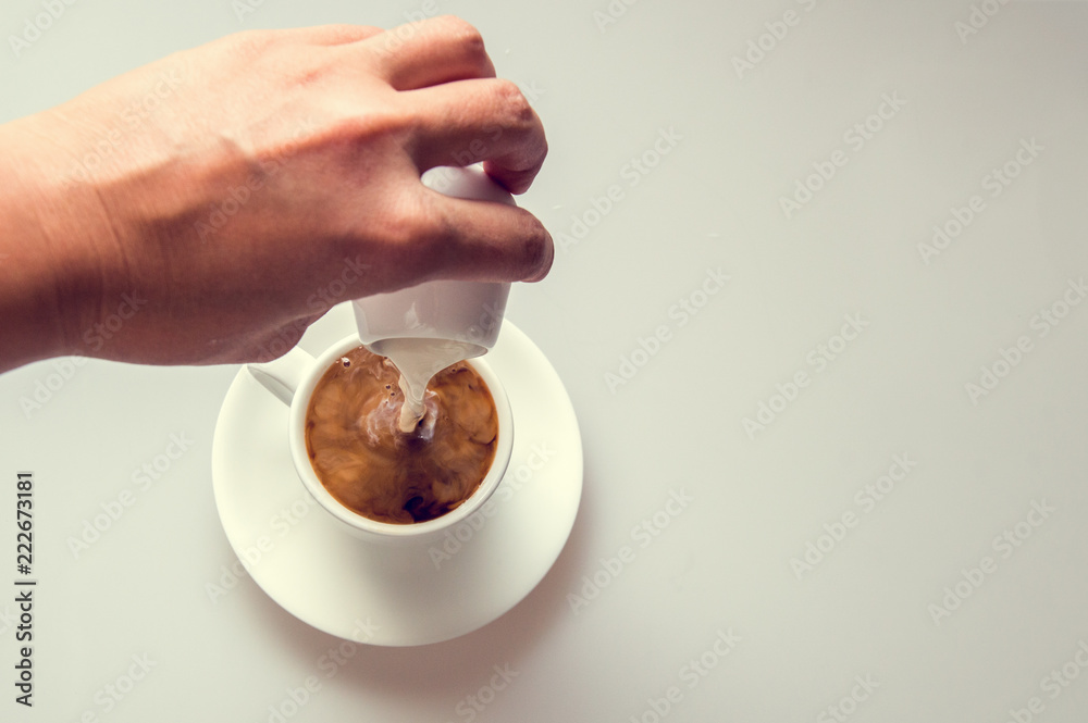 Pouring Cream Into Coffee