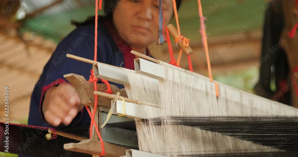Traditional textile manufacture in craft village where old women work ...