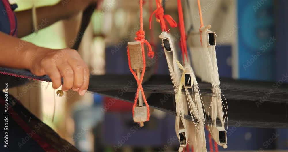 Traditional textile manufacture in craft village where old women work ...