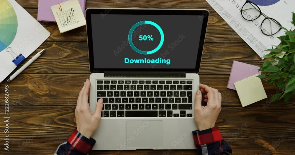 Blue circle of percents loading in the black screen of the laptop ...