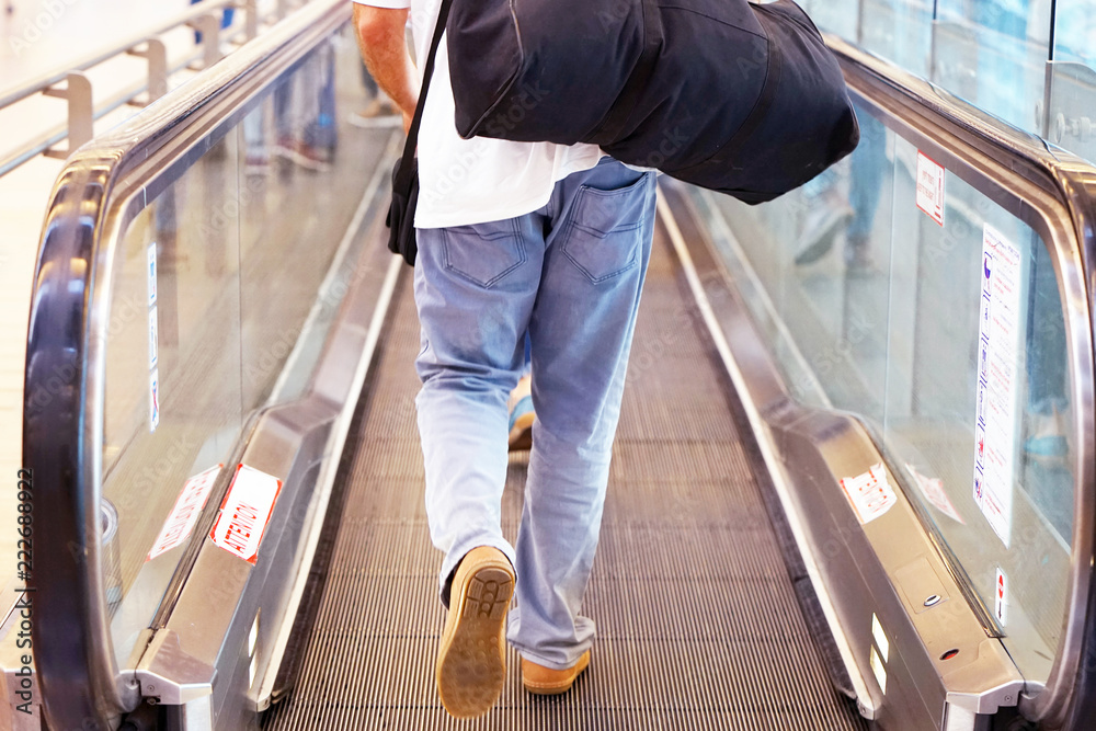 Men at horizontal escalator covered. Moving walkway, moving sidewalk ...