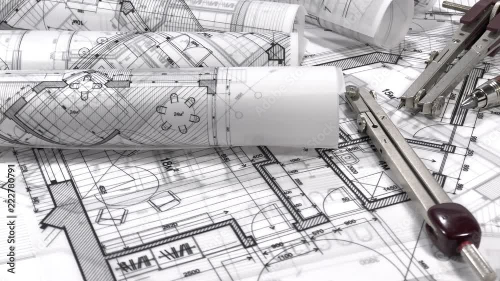 Blueprints - rolls of architectural drawings and compass smoothly ...