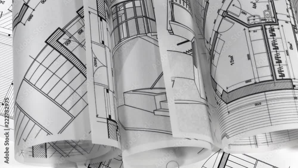 Blueprints - rolls of architectural drawings smoothly rotate on the ...
