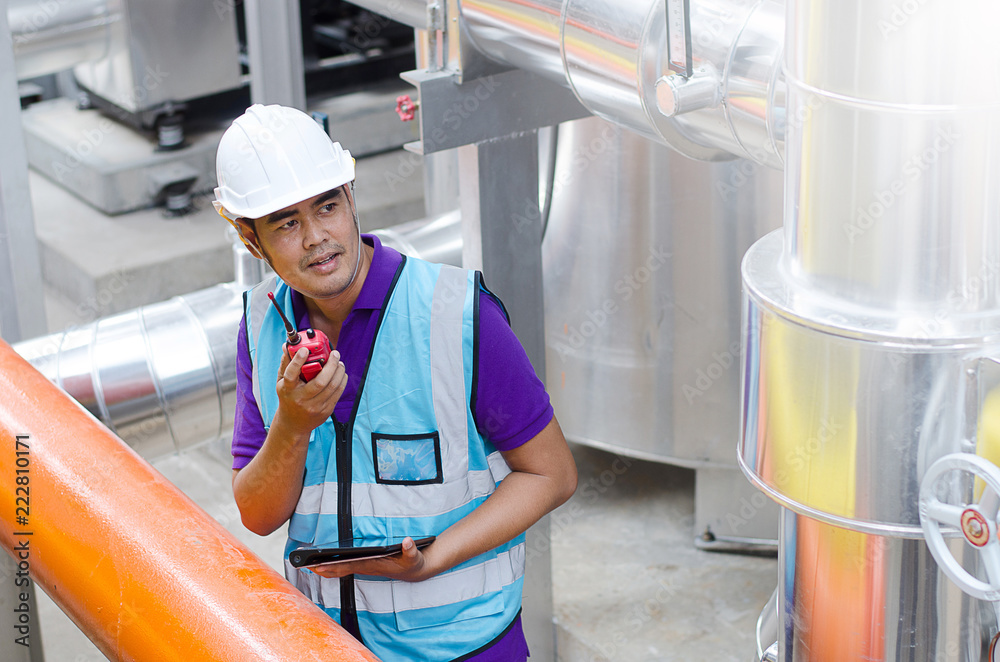 The male Asian engineers are examining the response and reporting ...