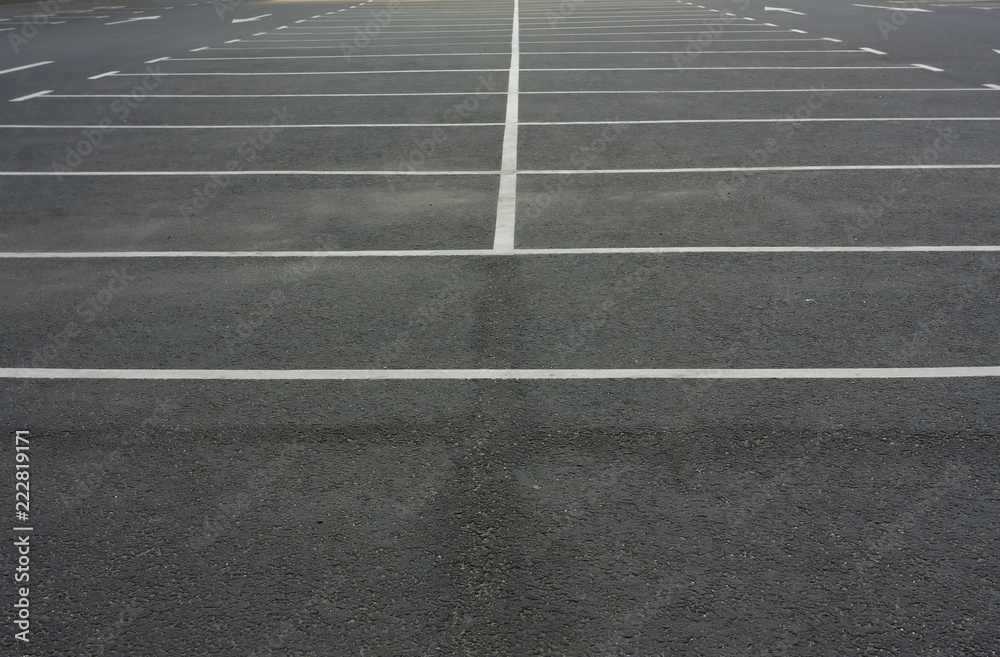 Car parking lot with white lines mark. White markings on asphalt in ...