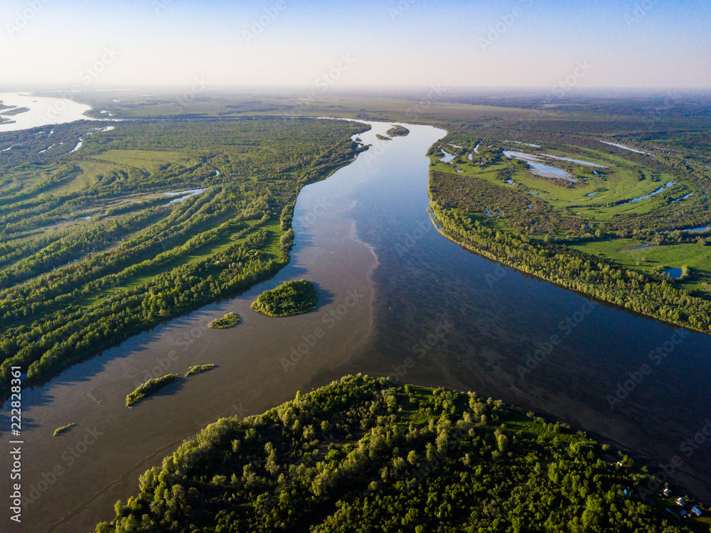 Ob river flows through the taiga. River landscape, beautiful sky ...