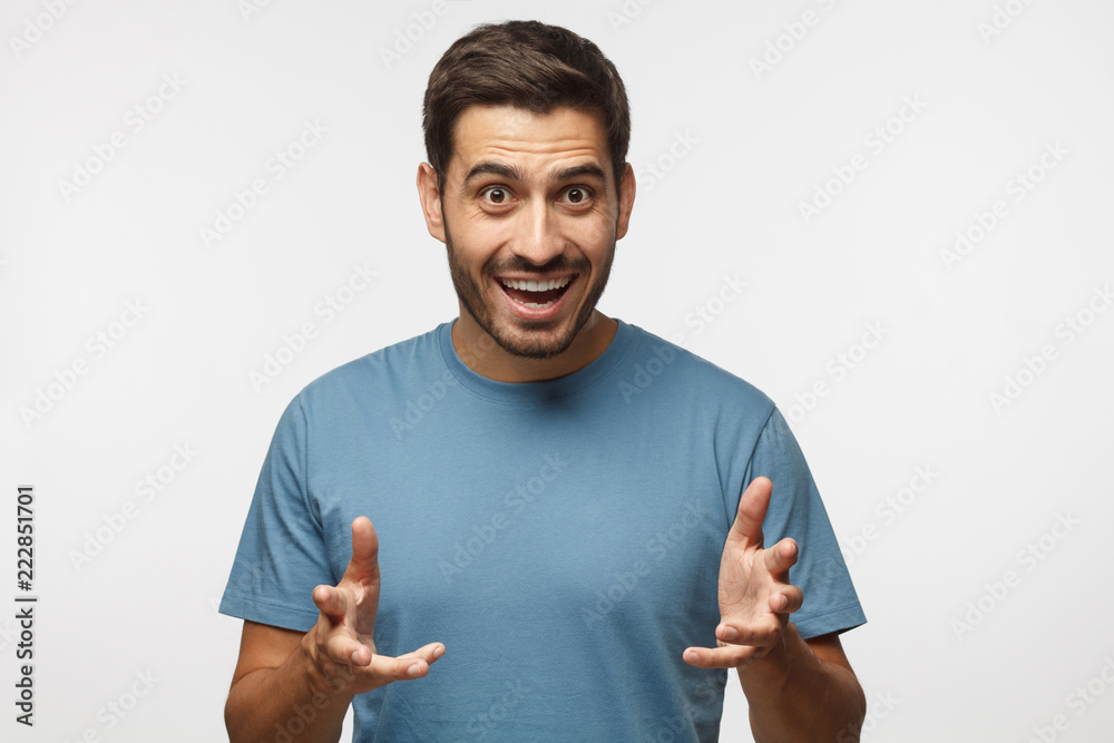 Oh my god! Are you kidding me? Wow! Really? Crazy shocked young man ...