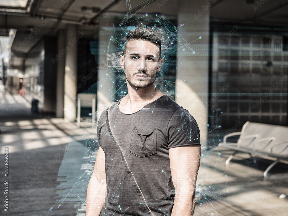 Concept of digitally connected person, a handsome young man surrounded ...