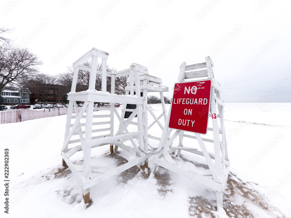 Wide angle view of three white wooden lifeguard towers on the beach in ...