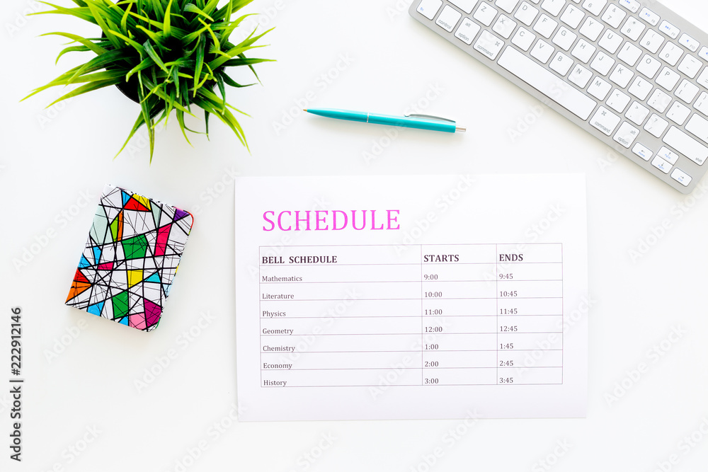 School student's schedule with time of lessons on white office desk ...