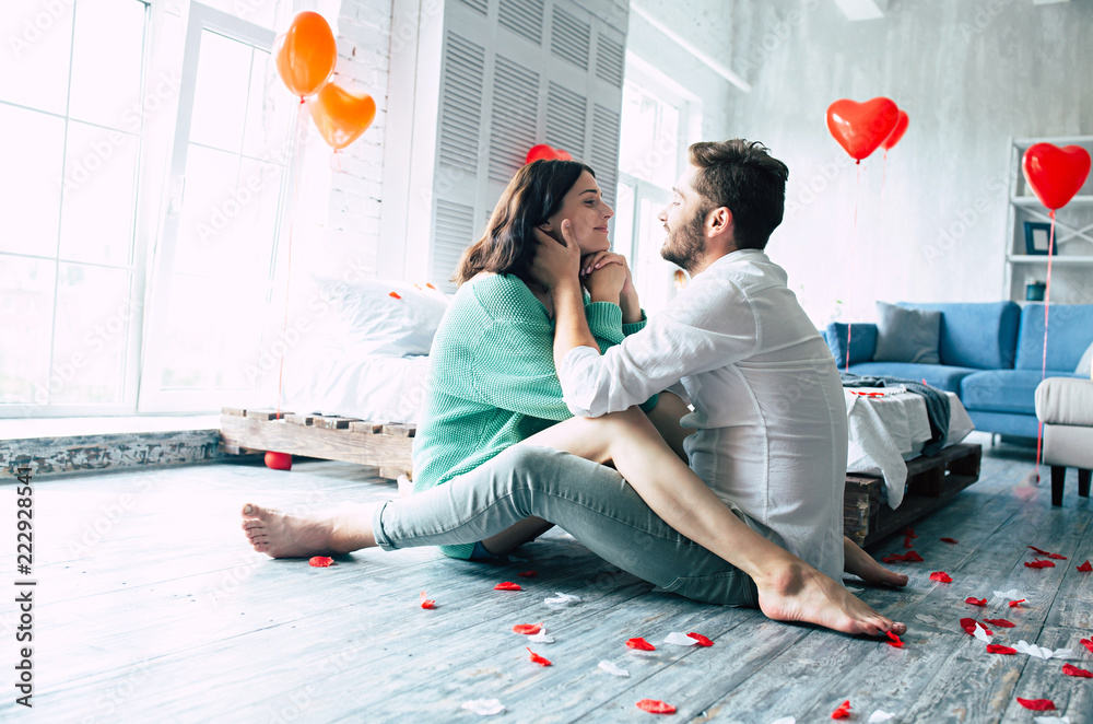 Beautiful young tender lovely couple are kissing and hugging each other ...