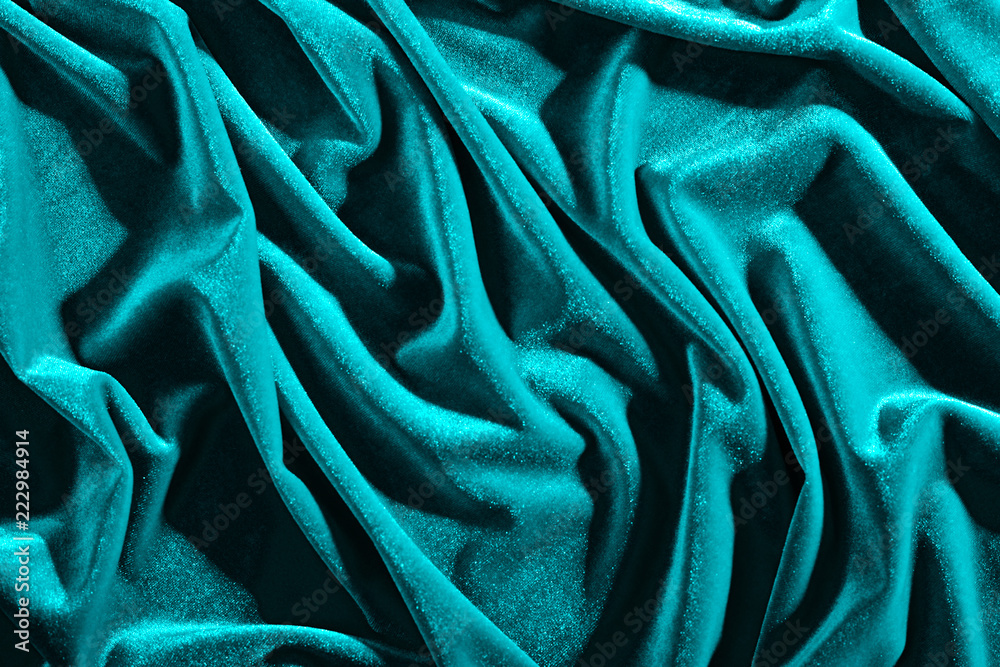 Cyan color velvet textiles for background or texture, wrinkled and ...
