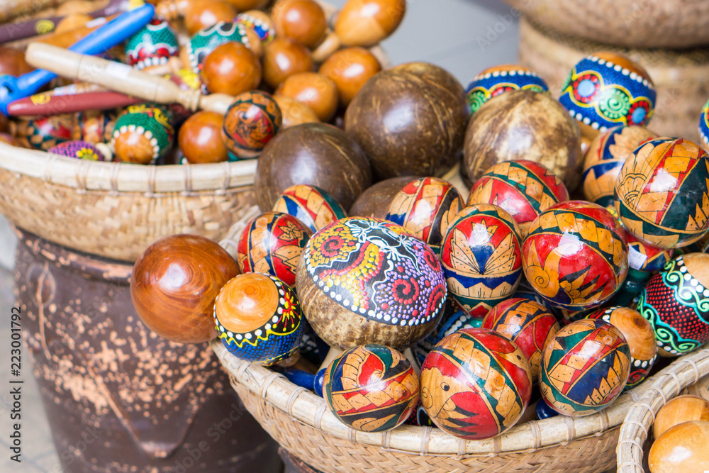 Handmade souvenirs made from coconut and bamboo in a local market of ...