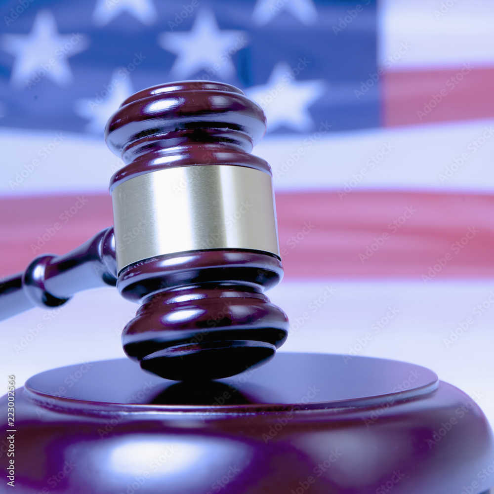 Judge gavel against United States national flag as symbol of judicial ...