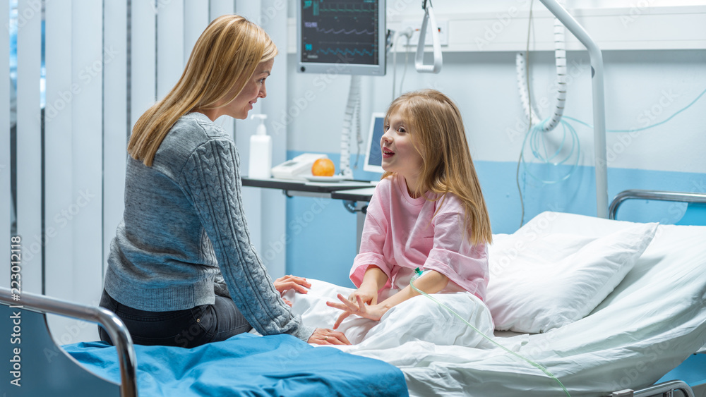 Healed Little Girl Sits on a Hospital Bed and Chats with Her Mother ...