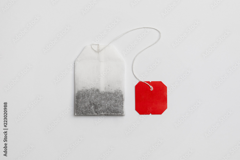 Tea bag with a sticker (label). Tea pack for mockup with a white ...