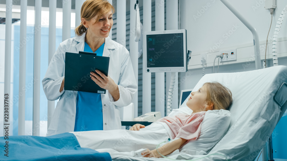 Recovering Little Girl Lies on a Bed In the Hospital, Friendly Doctor ...