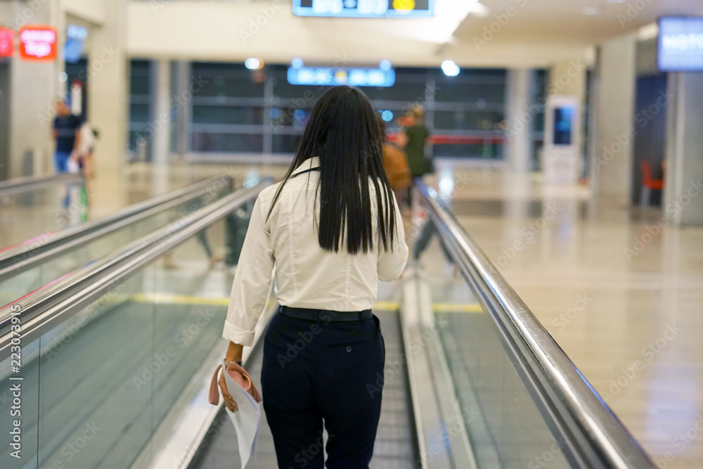 Women at horizontal escalator covered. Moving walkway, moving sidewalk ...