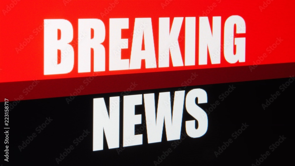 The text Breaking News over a red and black background on an LCD ...