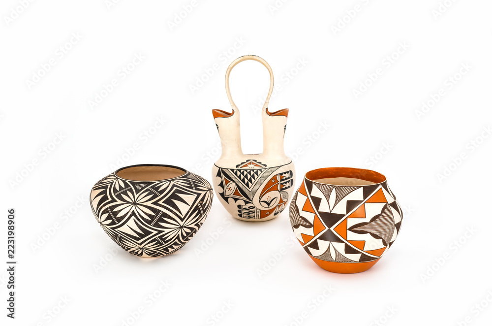 Three pieces of authentic Native American Pottery with a white ...