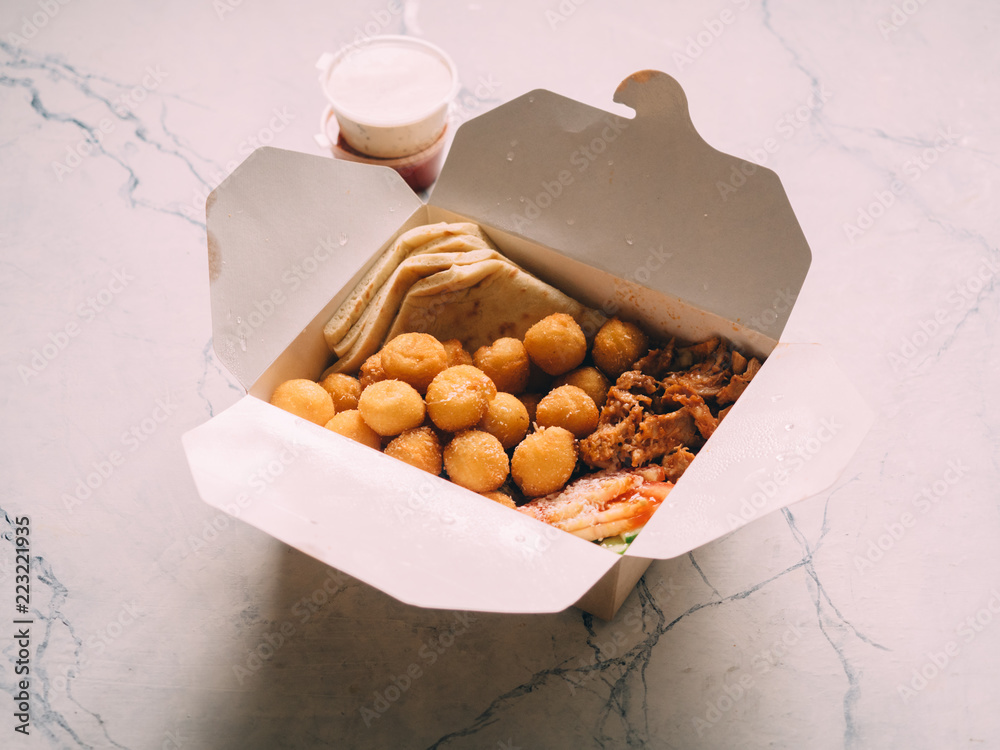 open gyros with chicken, potato balls, pita and vegetables Stock Photo ...