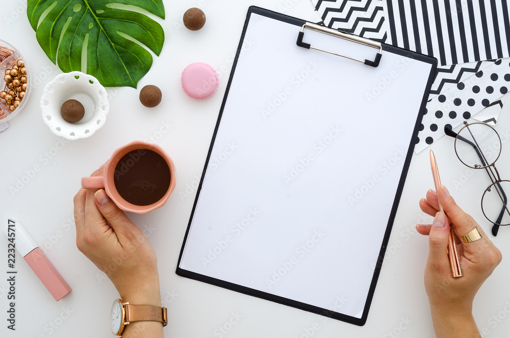 Flat lay clipboard mockup. Woman's hands holds golden pen and coffee ...