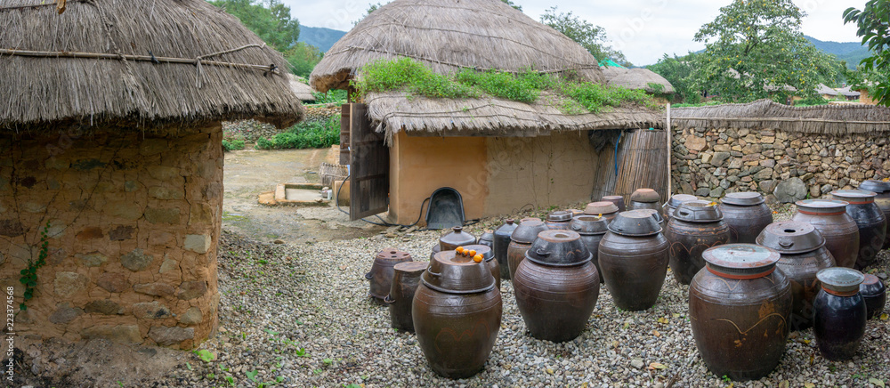 Vases of kimchi were lefted outside the house. Kimchi is a traditional ...