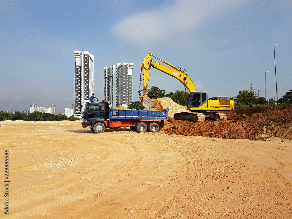 Heavy machinery doing earthwork at the construction site. Works carried ...
