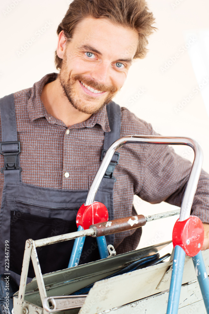 Sympathischer Handwerker mit Werkzeug Stock-Foto | Adobe Stock