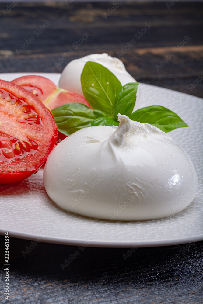 Fresh soft white burrata, ball buttery cheese, made from a mix of ...