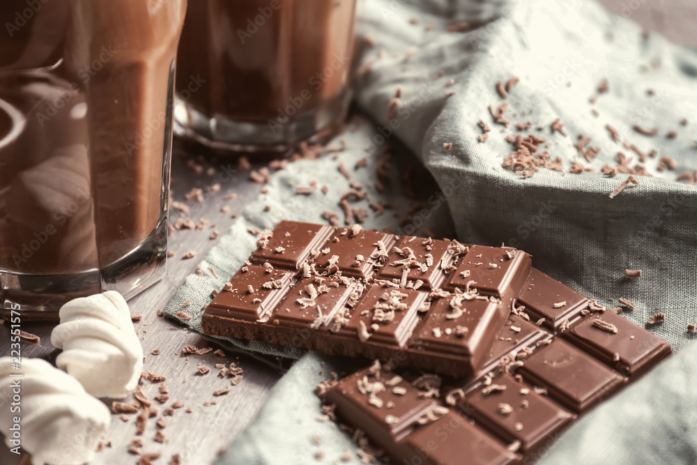 Pieces of tasty chocolate with cacao drink on table Stock Photo | Adobe ...