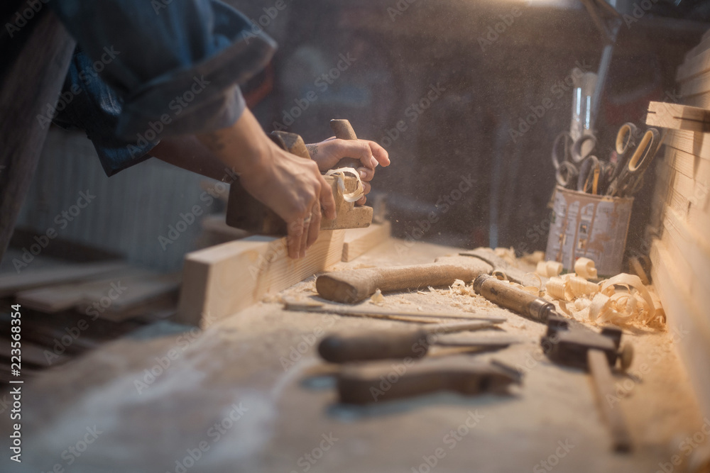 Handmade concept. Women's hands do the product of wood. Wood workshop ...