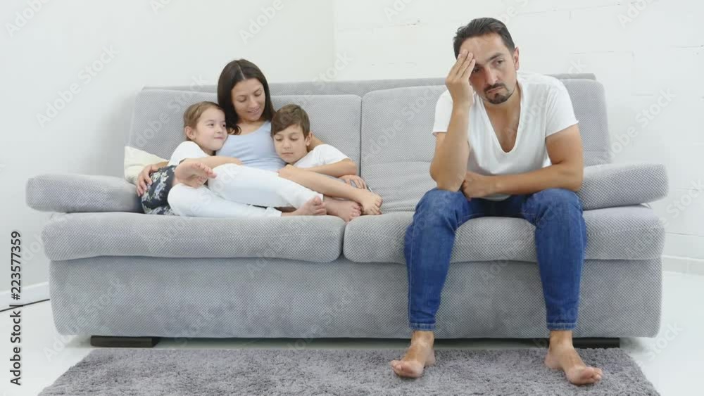 Quarell in a family. Sad husband on the front and his wife and two kids ...